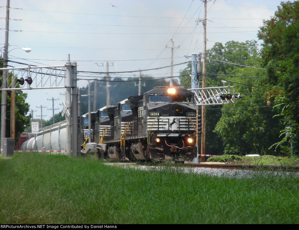 Three NS GE's and a SD80MAC running elephant style leading a manifest train east